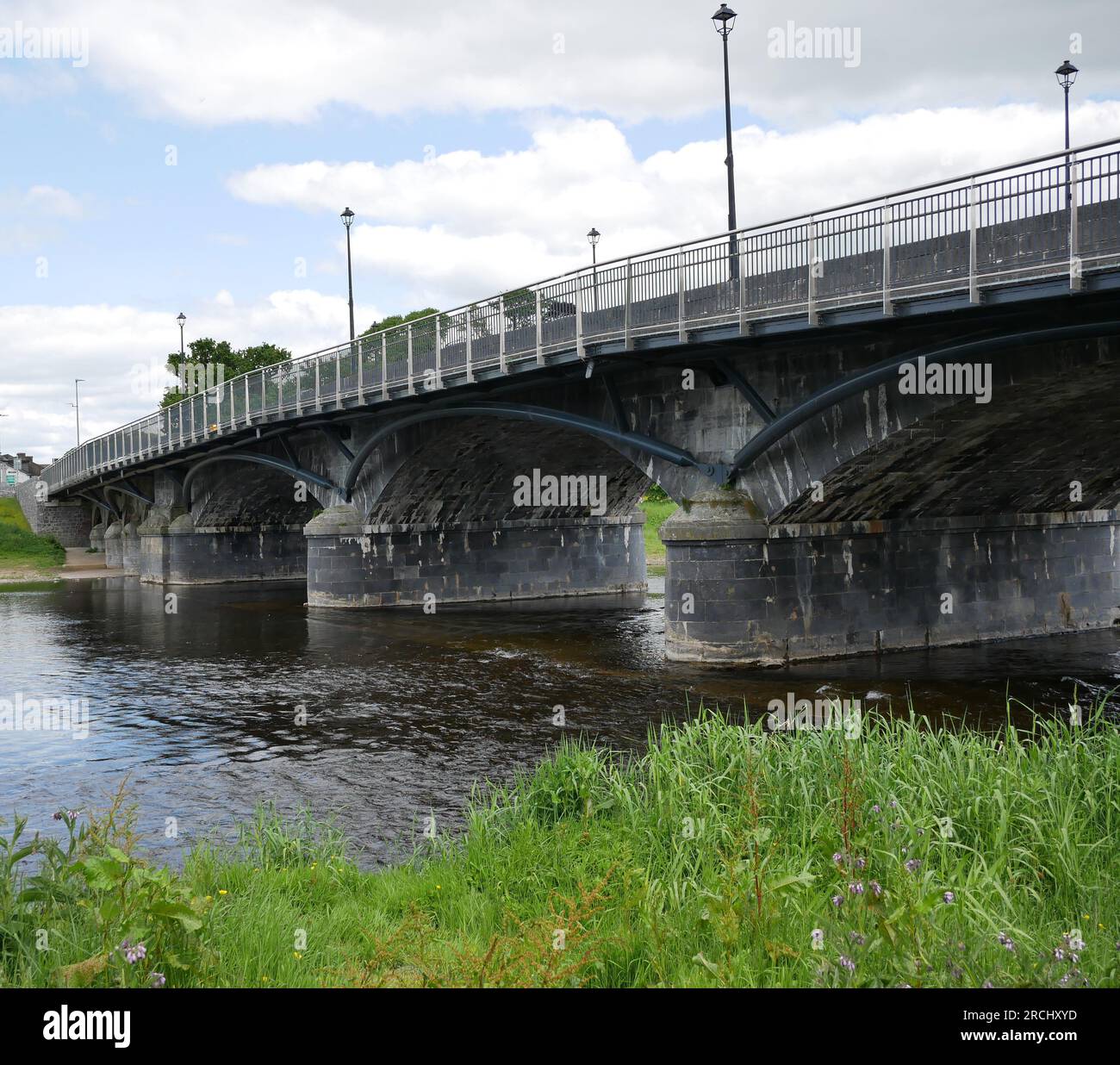 Old stone bridge in Ireland, ancient bridge over the river background ...