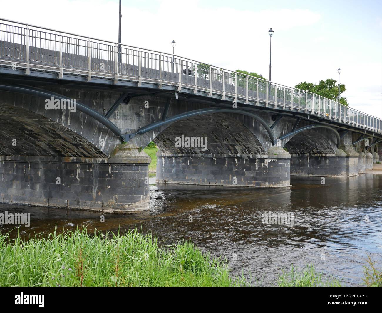 Old stone bridge in Ireland, ancient bridge over the river background ...