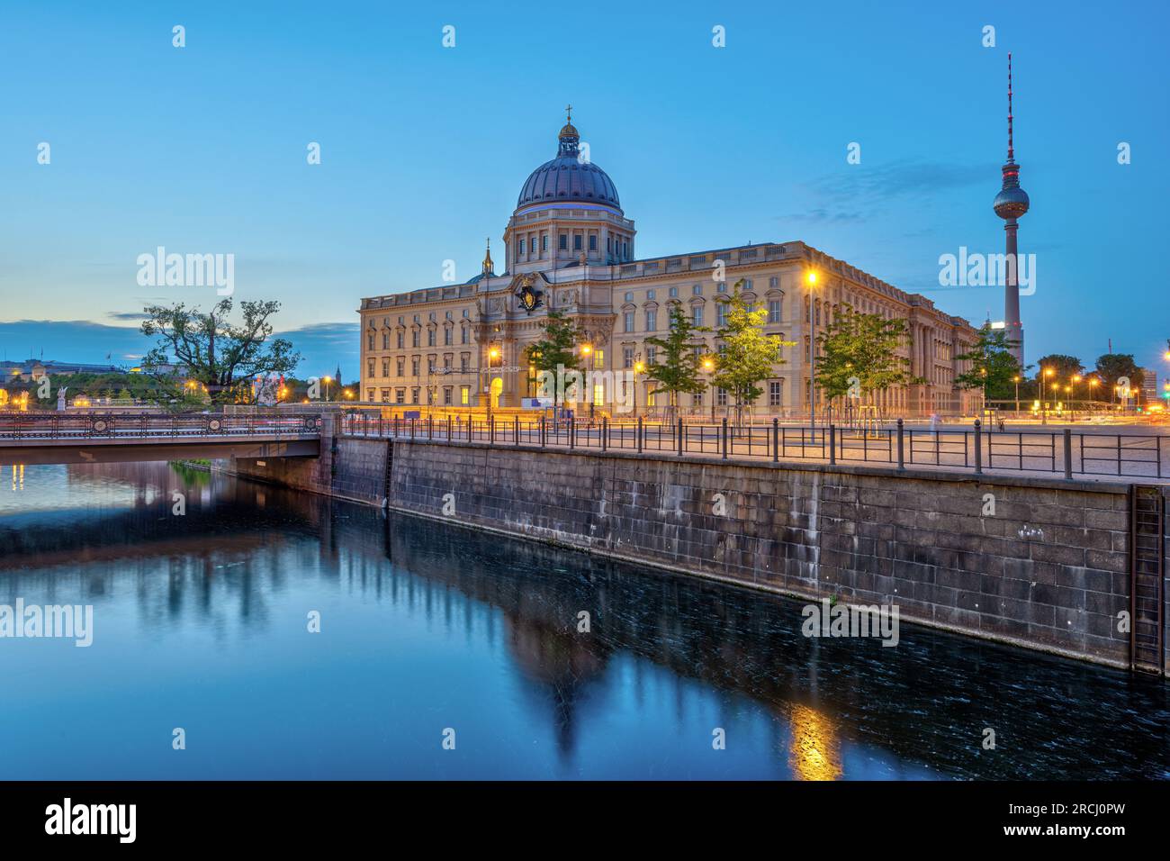 The reconstructed Berlin City Palace and the famous TV Tower at dusk ...