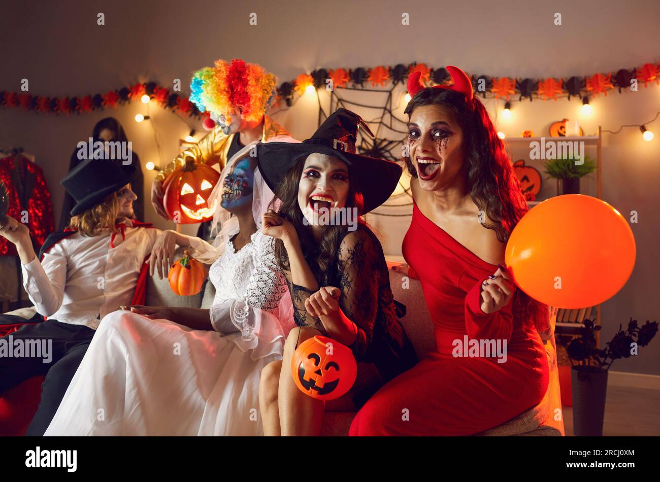 Group of creative and fun friends celebrate Halloween together by ...