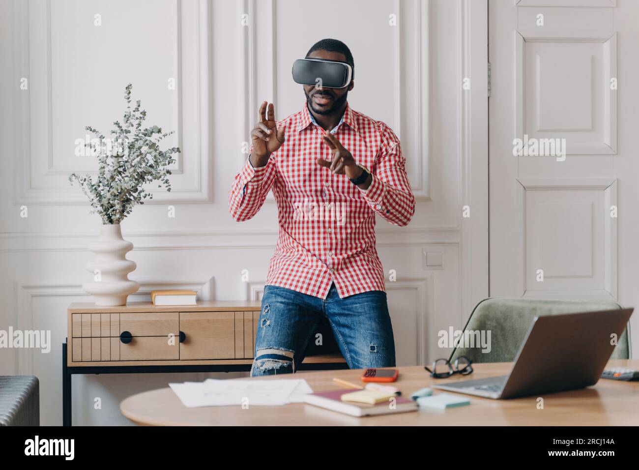 African American Software Developer In Vr Headset Testing 3d Games And Apps In Modern Home