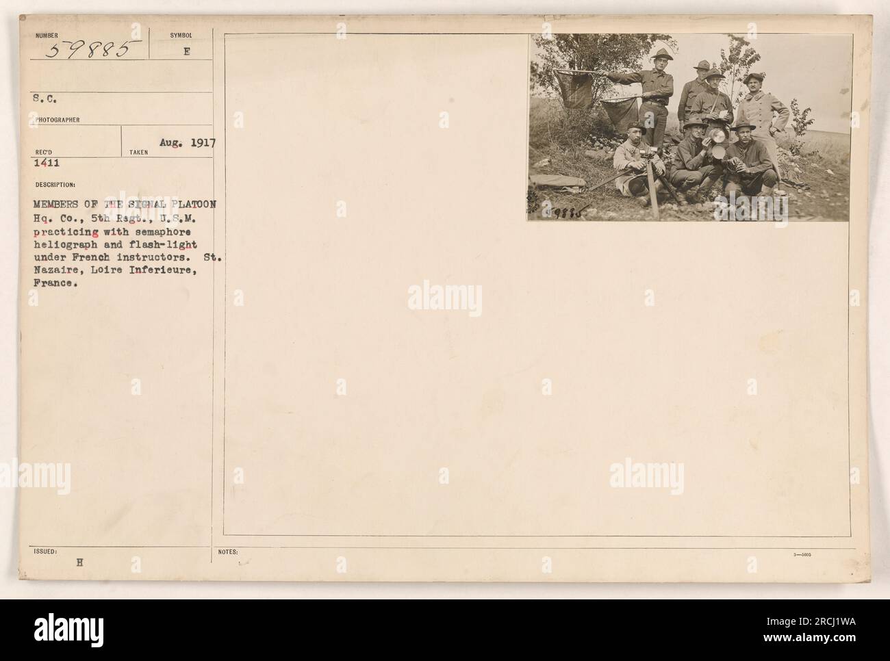 The photograph shows members of the Signal Platoon Hq. Co., 5th regt ...