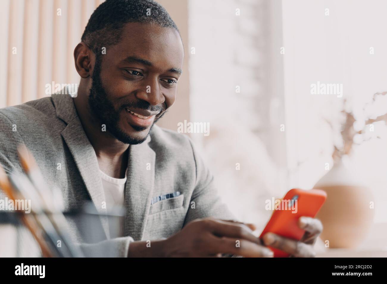 Digital device distracted african hi-res stock photography and images ...