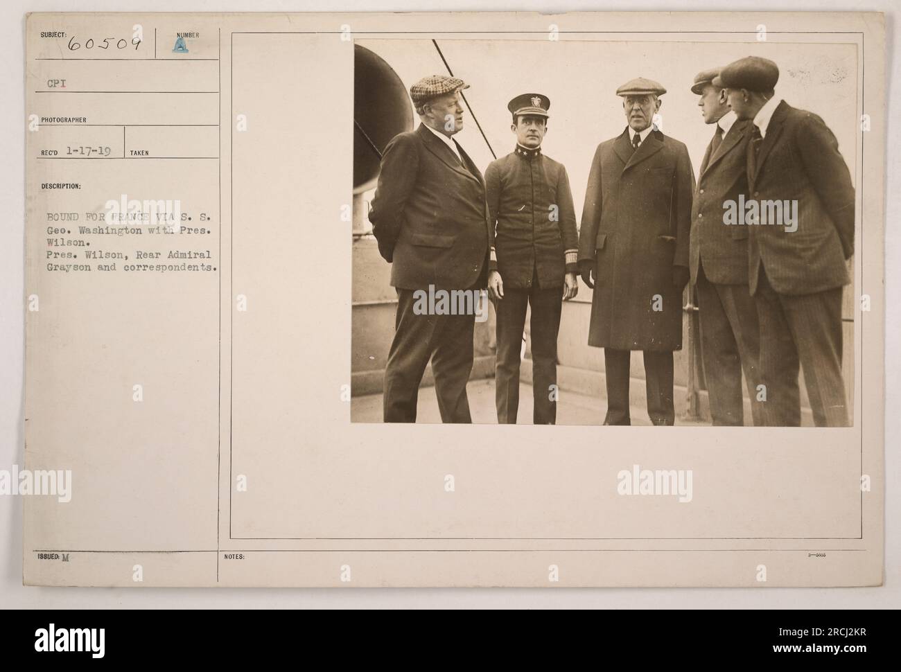 President Wilson, along with Rear Admiral Grayson and a group of ...