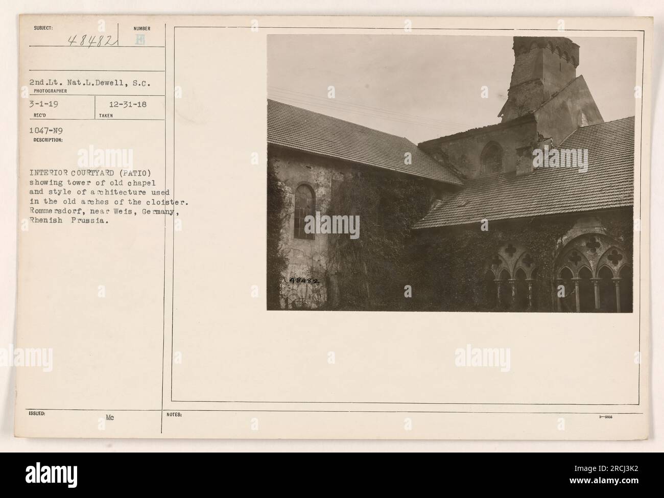Interior courtyard (patio) displaying the tower of an old chapel and ...