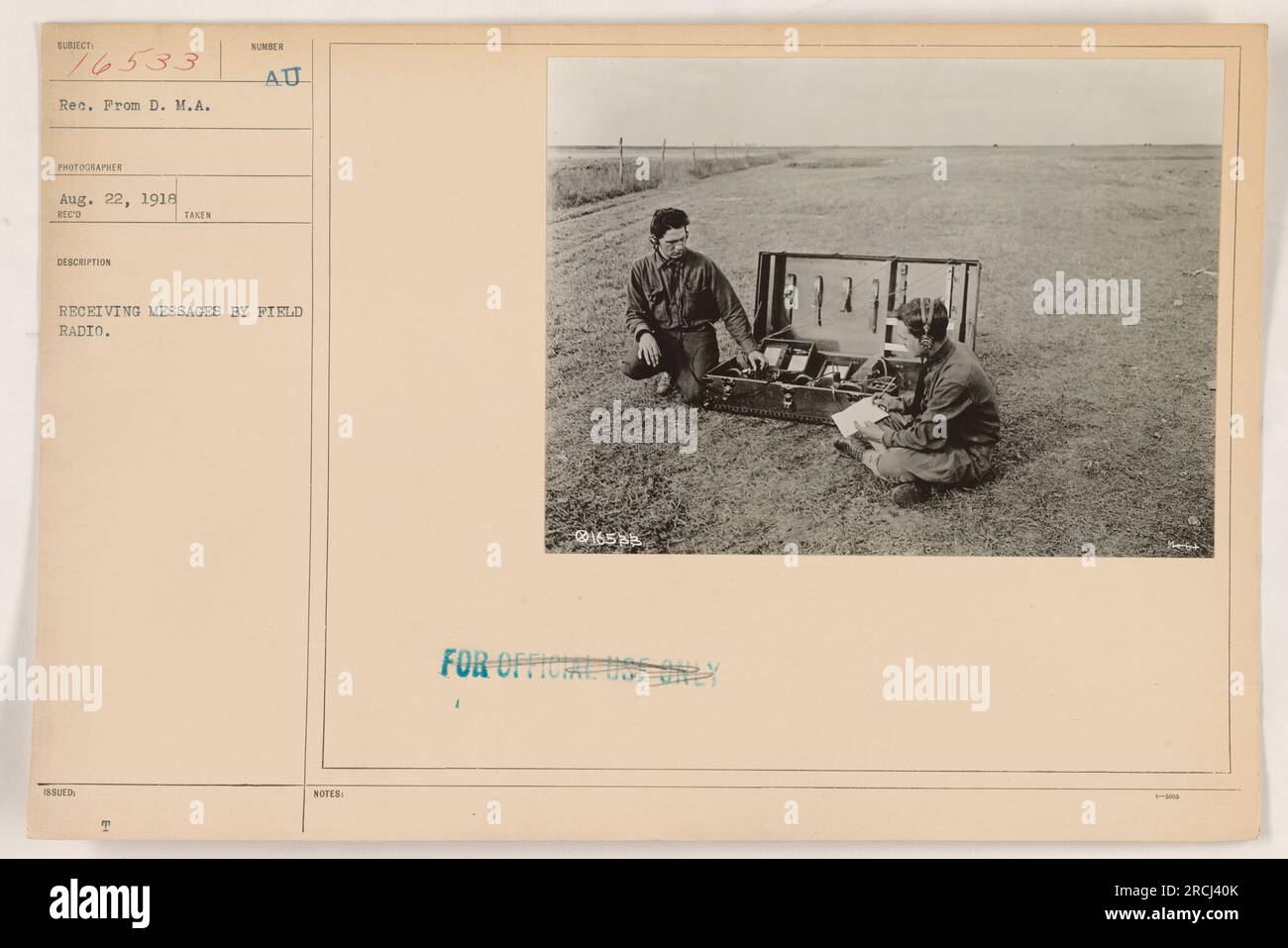 Soldiers receiving and transmitting messages via field radio during ...