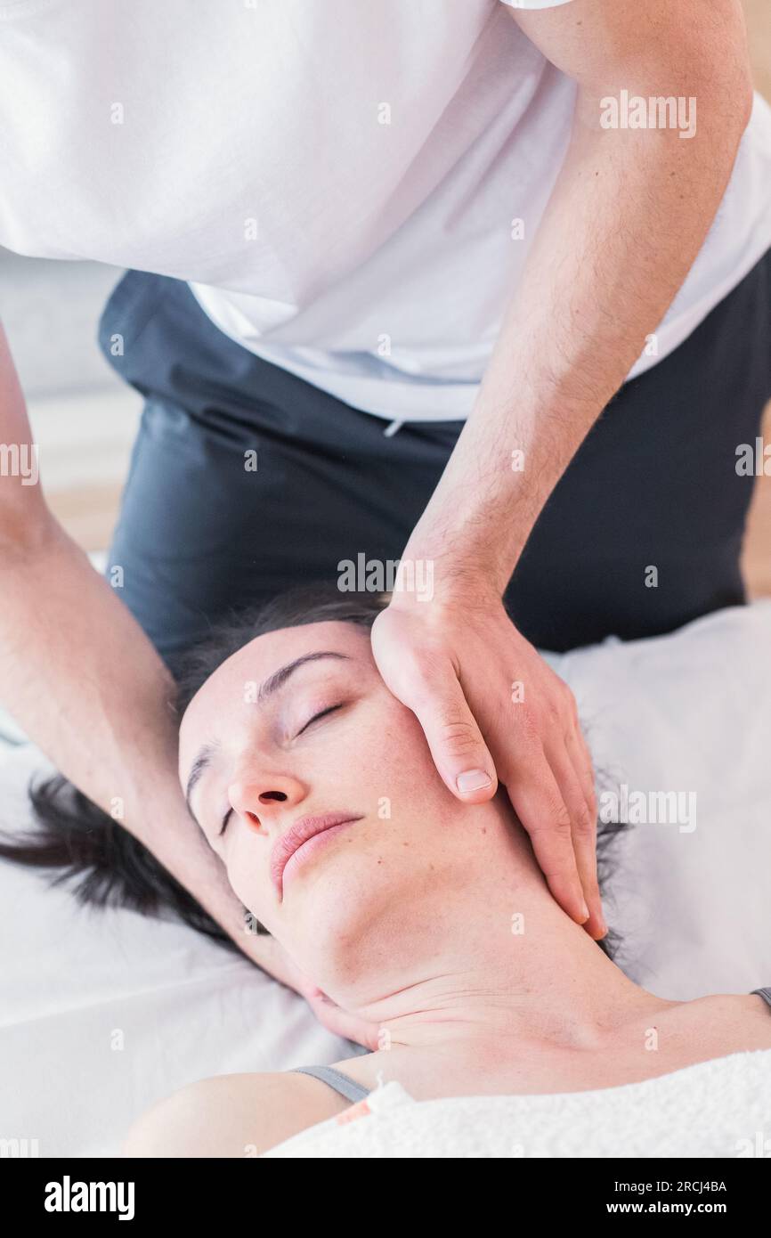 Therapist doing a session with localized massage in the region of the ...