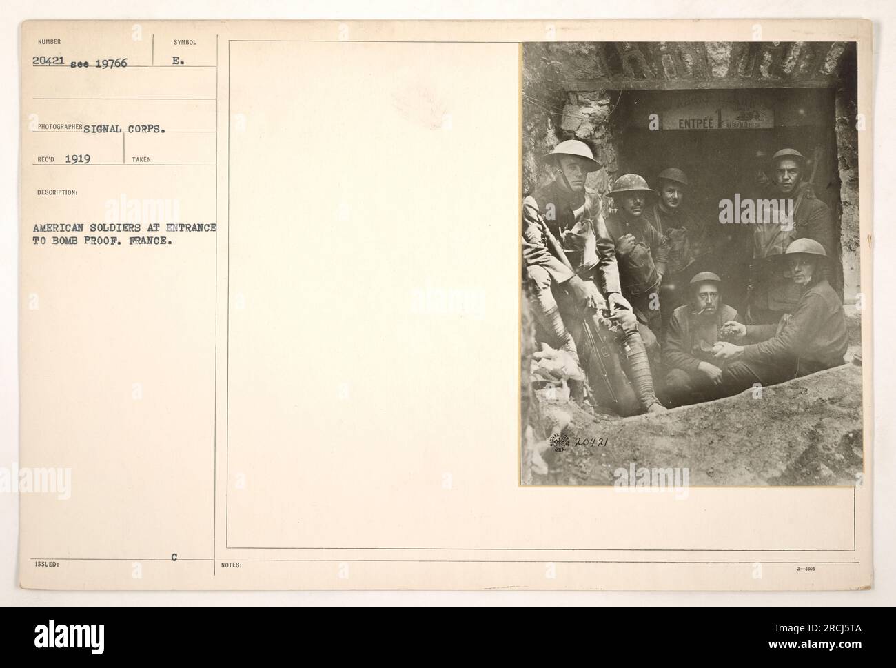 American soldiers stand at the entrance to a bombproof in France during ...