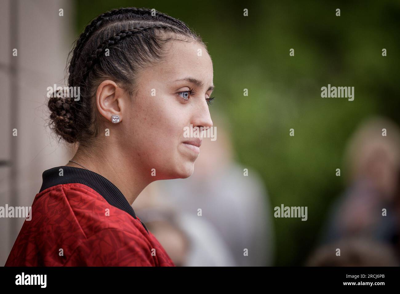 Side view of Mia Enderby of Liverpool FC Women as she talks to young ...