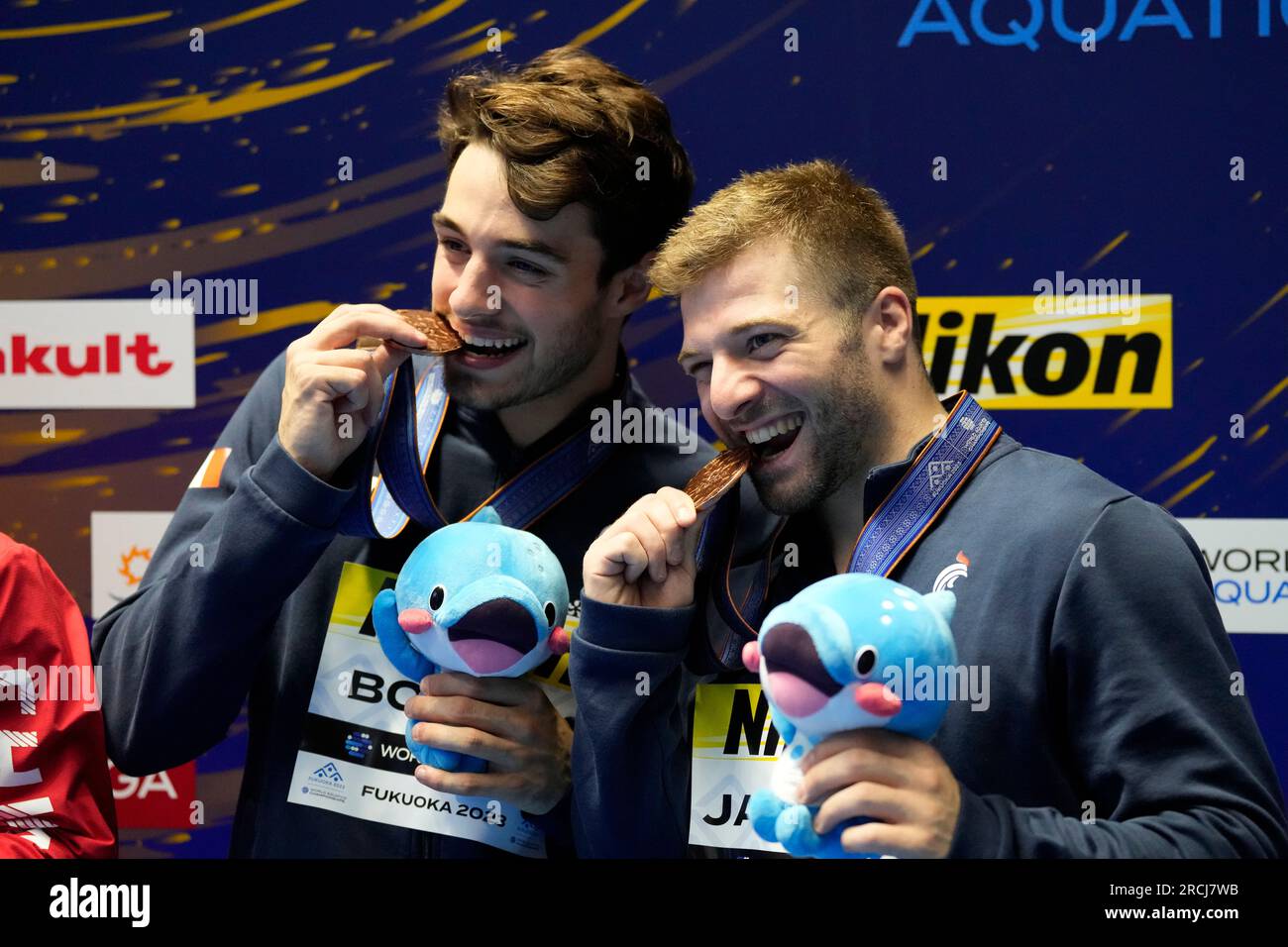 Jules Bouyer and Alexis Jandard of France celebrate with their bronze ...