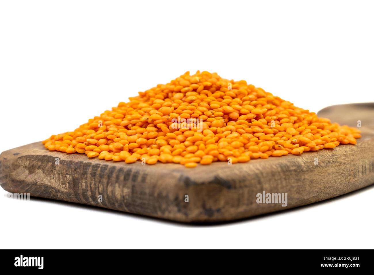 Red lentils isolated on white background. Raw red lentil on wood serving board Stock Photo - Alamy