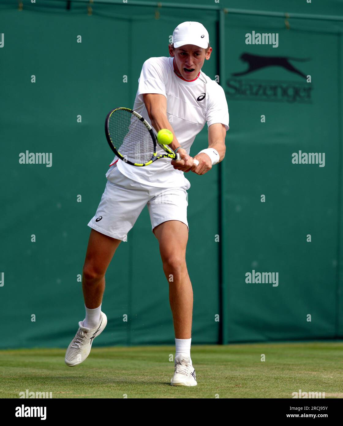 Henry Searle in action against Cooper Williams during the Boys' Singles ...