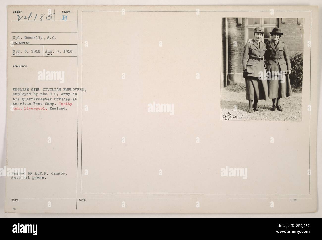 American soldier standing with a group of civilian employees at the ...