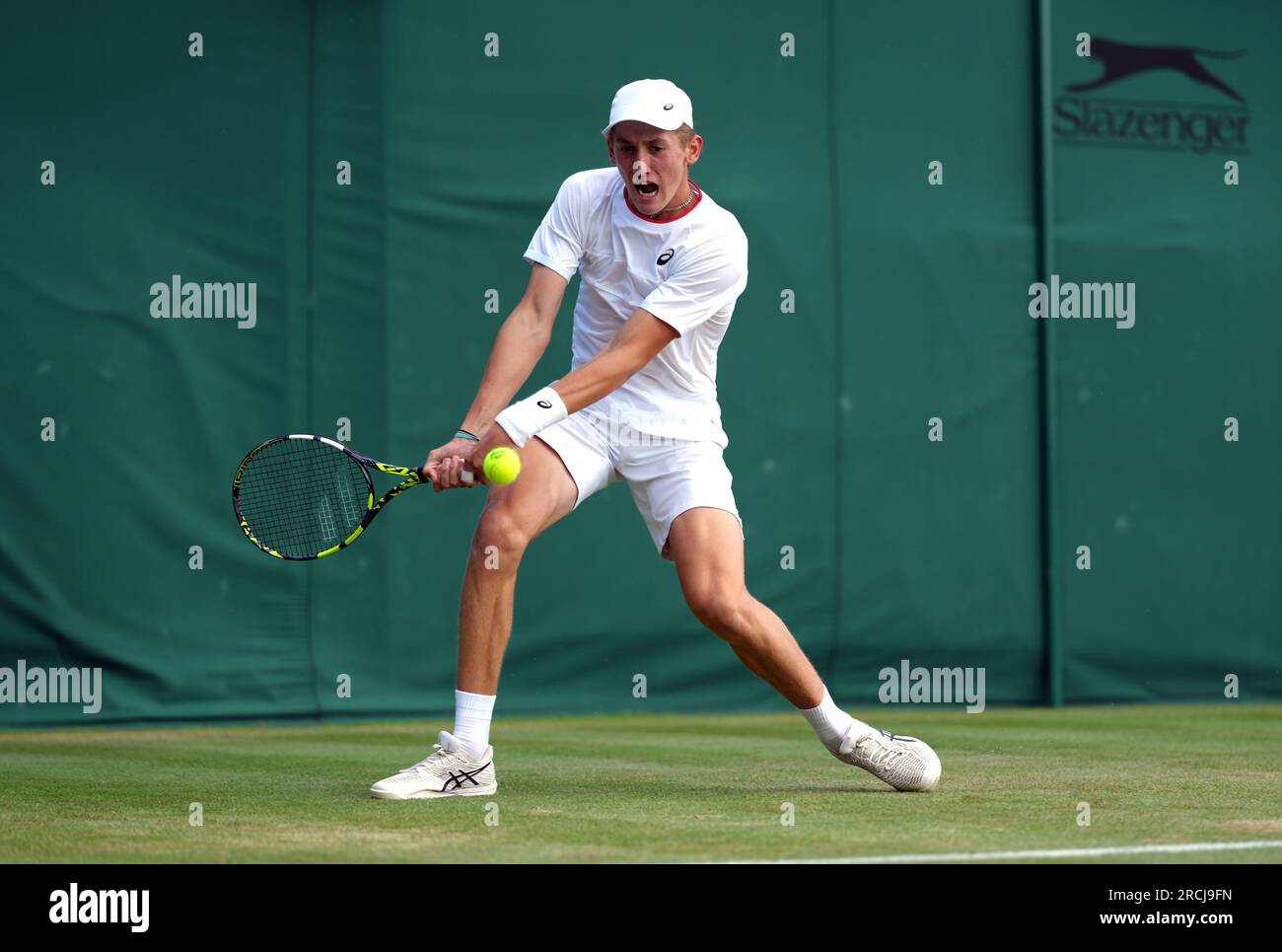 Henry Searle in action against Cooper Williams during the Boys' Singles ...