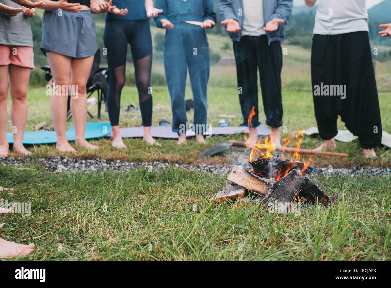 Coal walking or fire walking. Barefoot person on burned wood and hot ...