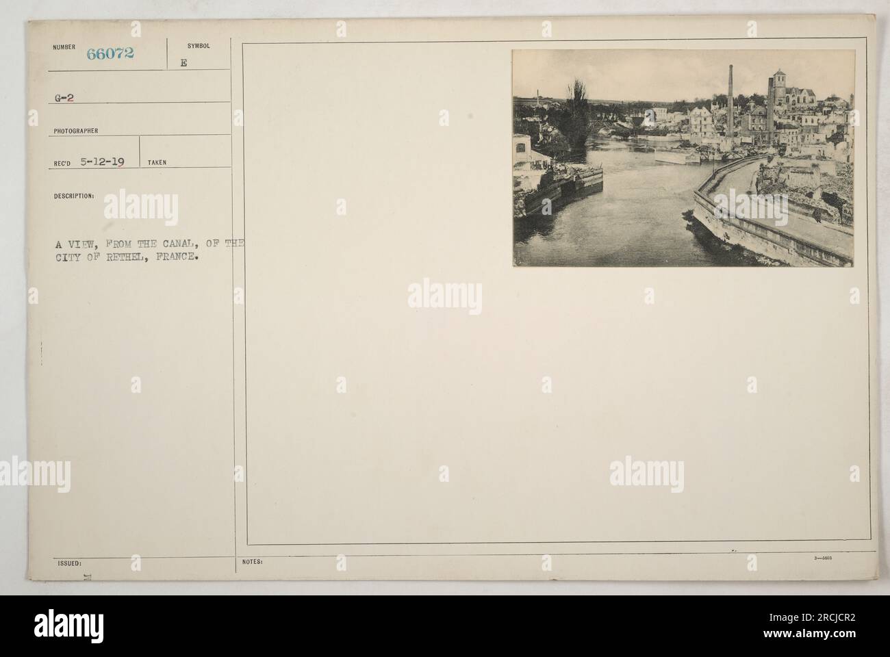 A photograph taken from the canal, showing the city of Rethel in France ...