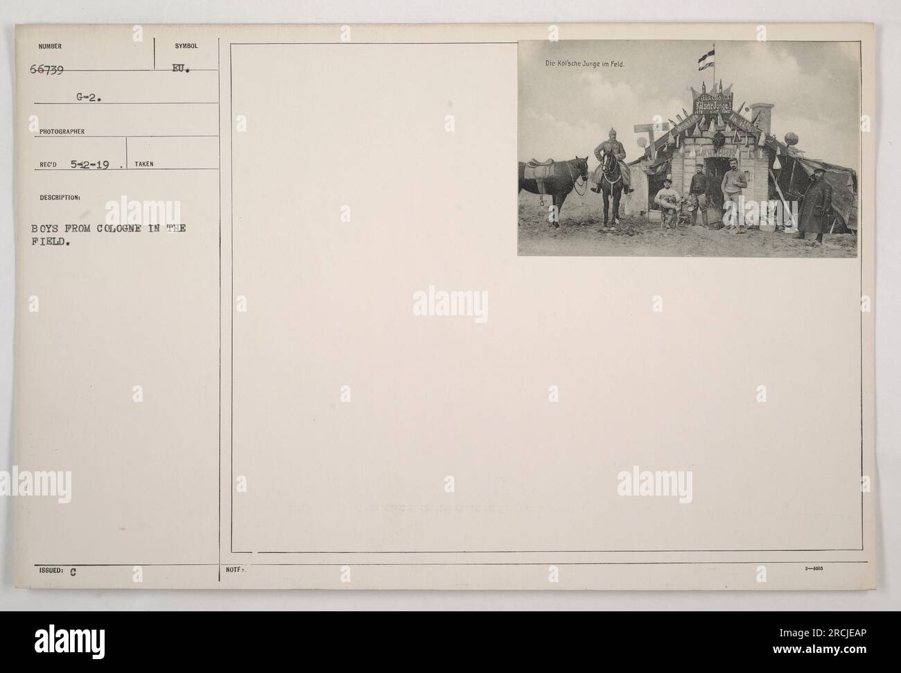 American soldiers with boys from Cologne in a field. The vehicle seen ...