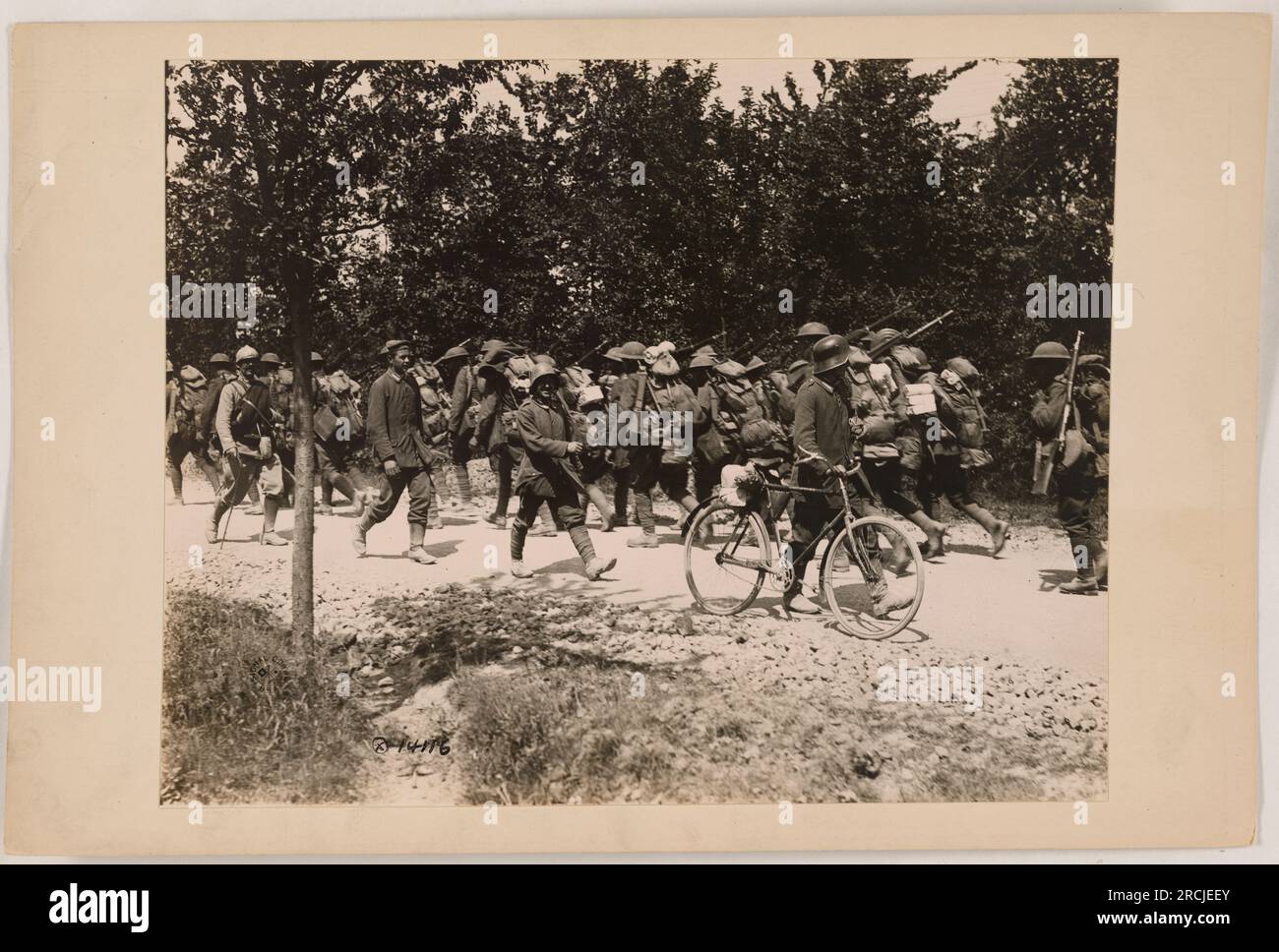 American soldiers working together to load ammunition onto a horse ...