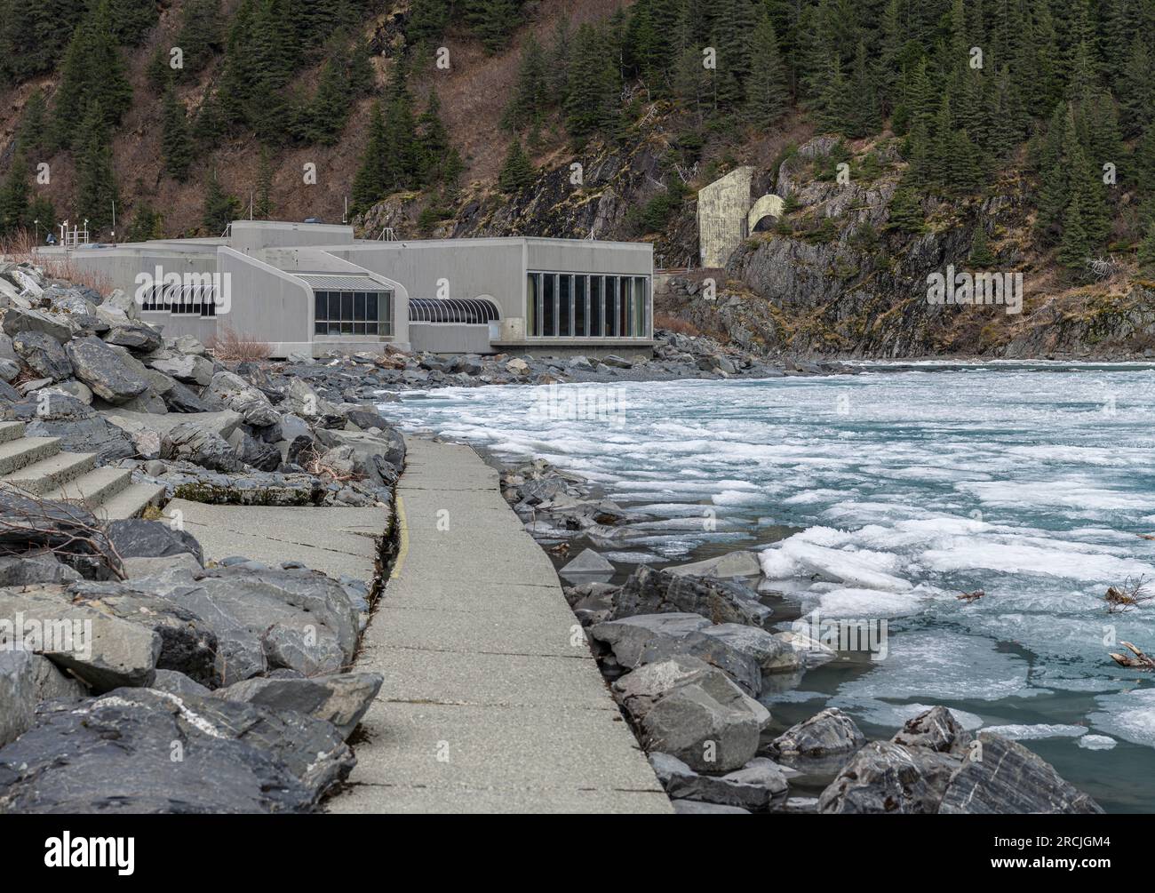 Begich Boggs Visitor Center from the edge of ice covered Portage Lake ...