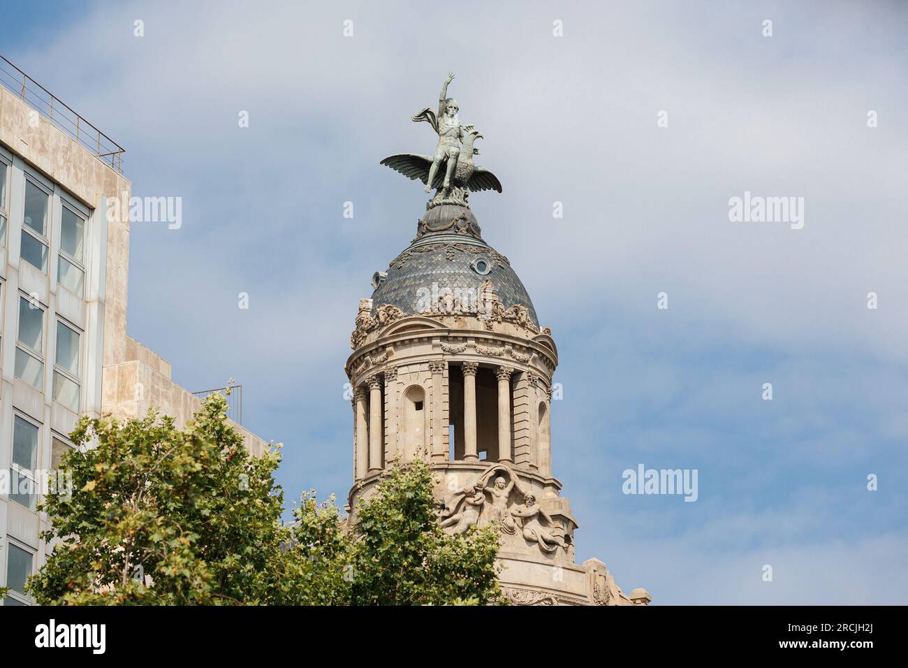 The Dome and top Statues of La Union and el Fenix on Passeig de Gracia ...