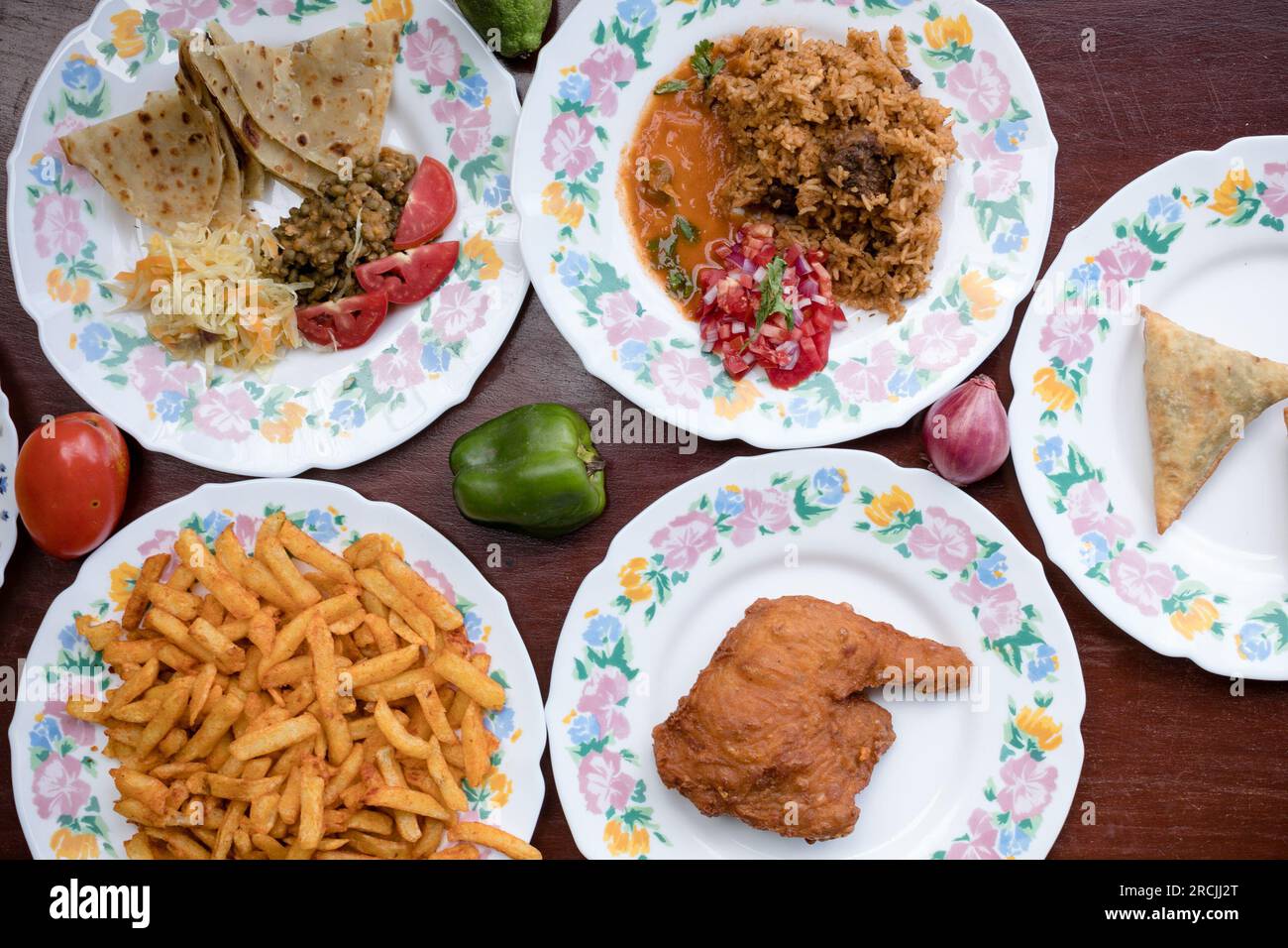 Kenyan cuisine includes ugali, chapati, githeri, goat, Nyama Choma ...