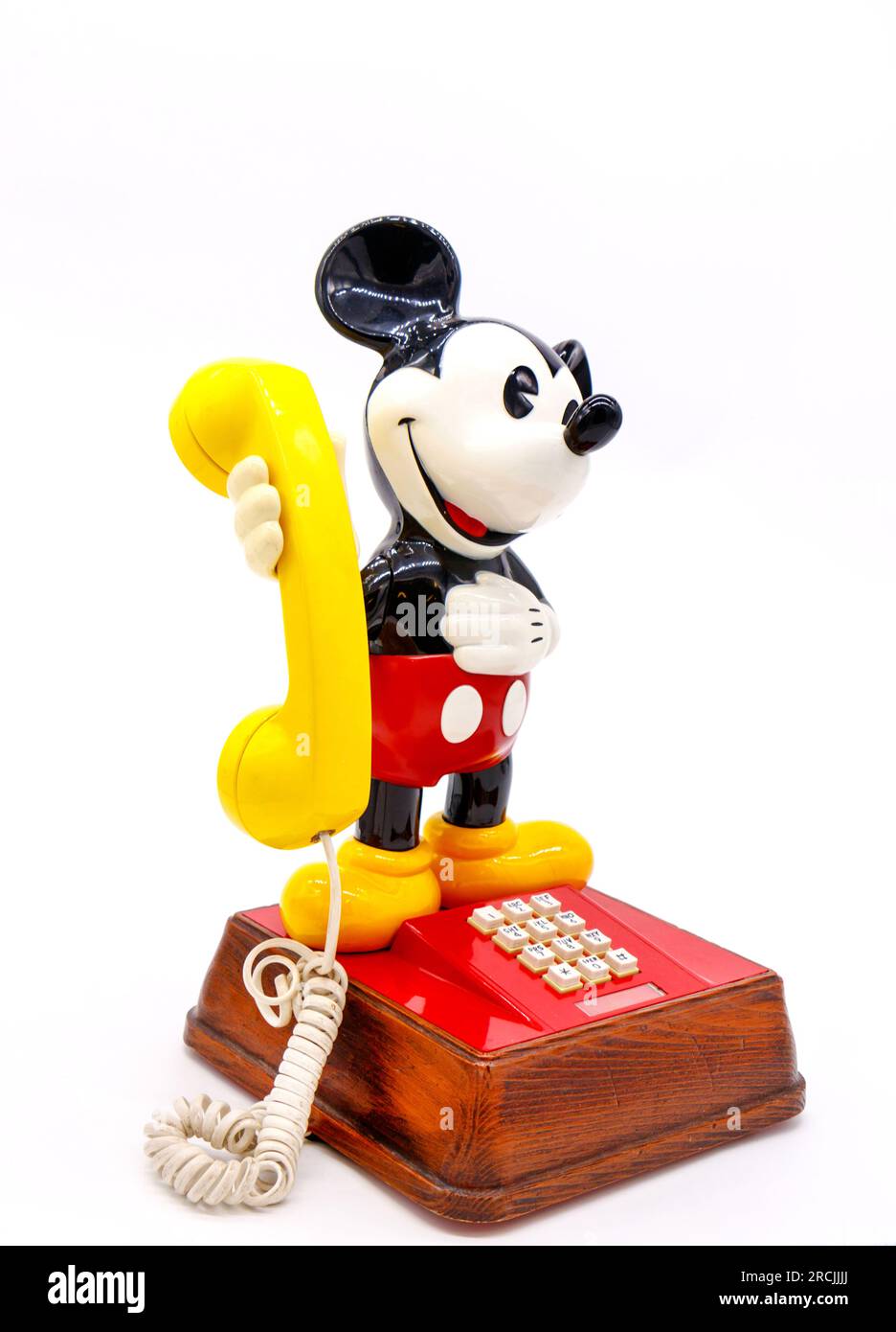 1970s vintage novelty mickey mouse telephone on wooden base Stock Photo ...
