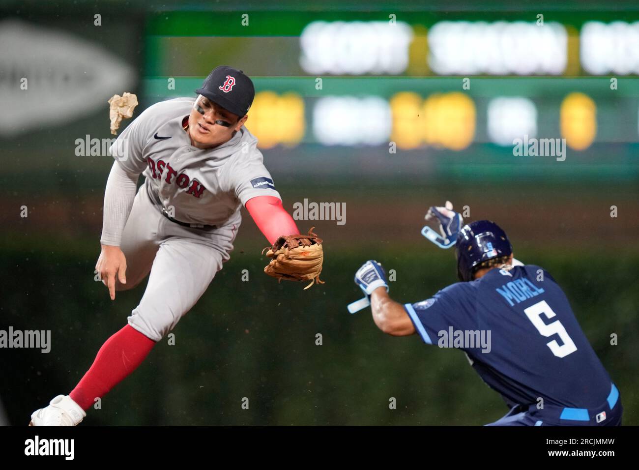 Boston Red Sox shortstop Yu Chang is unable to field a throw from catcher Connor Wong as Chicago ...