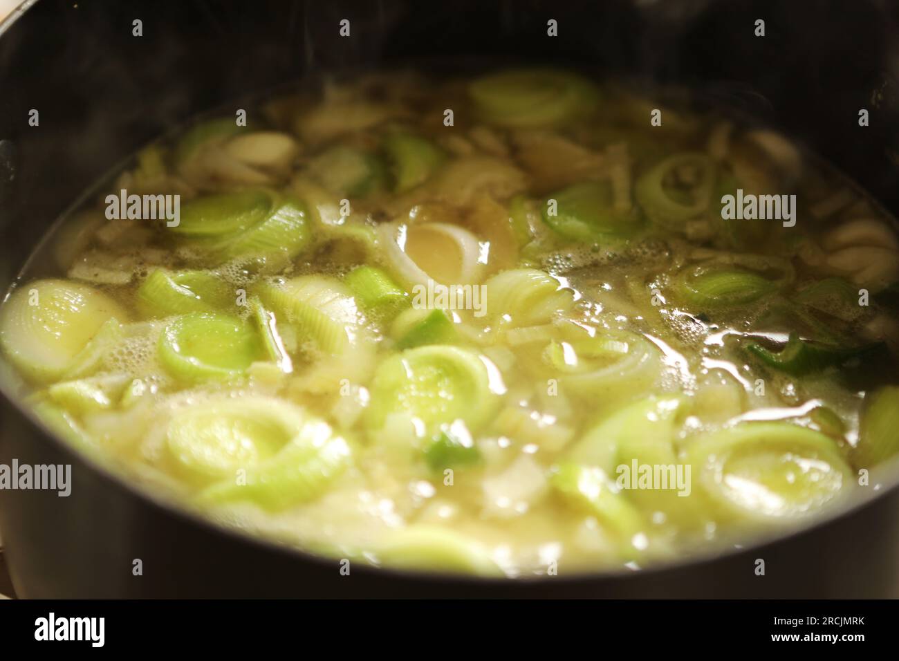 Leak and potato soup in a brown dish Stock Photo - Alamy
