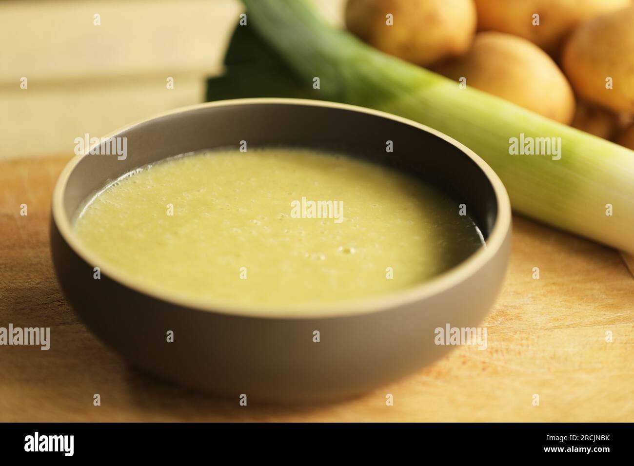 Leak and potato soup in a brown dish Stock Photo - Alamy
