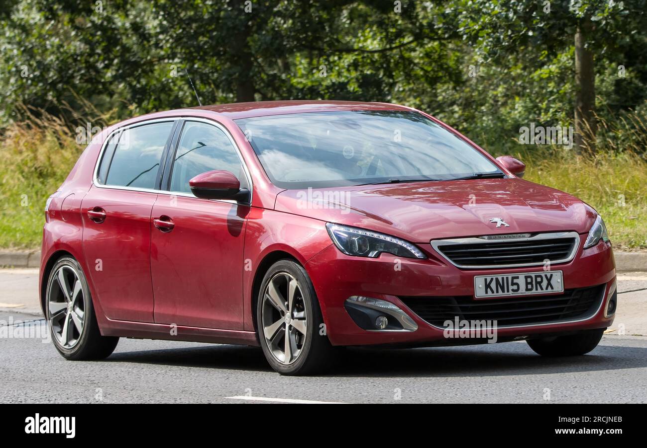 Milton Keynes, UK - July 13th 2023: 2015 red diesel engine PEUGEOT 308 ...