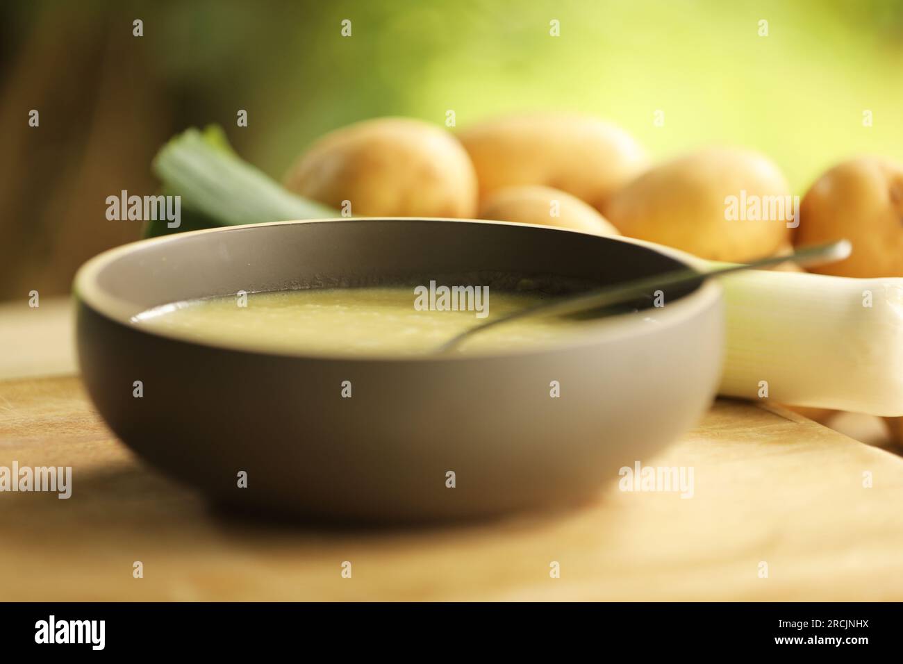 Leak and potato soup in a brown dish Stock Photo - Alamy