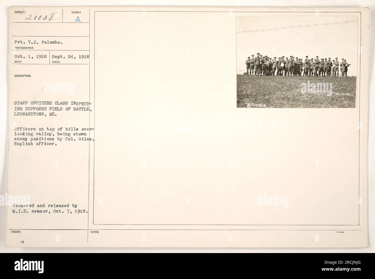 Pvt. V.J. Palumbo pictured with staff officers inspecting a supposed ...