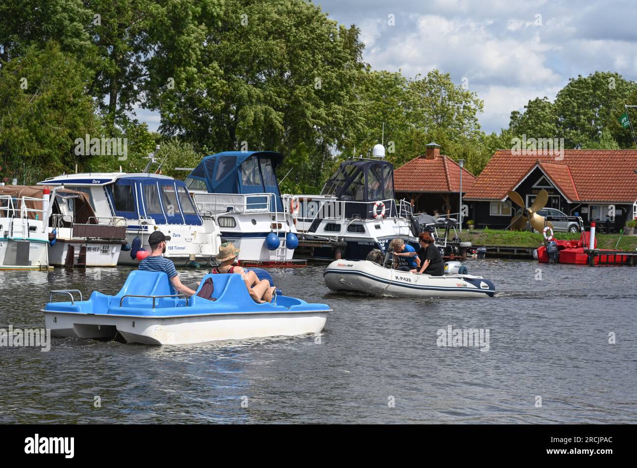 Timmel, Germany. 15th July, 2023. A couple enjoys a ride on a pedal ...