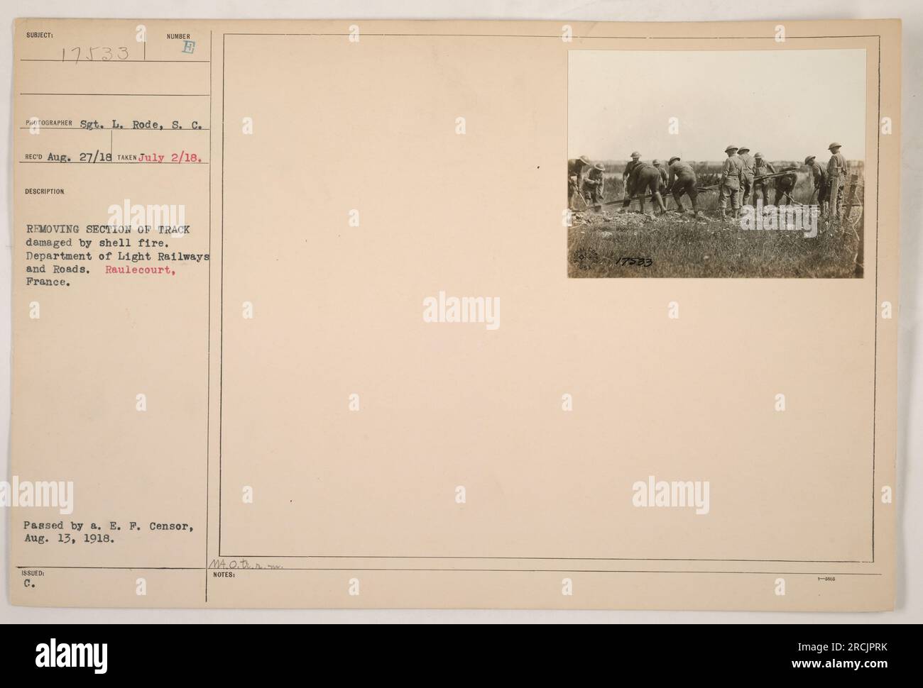 Soldiers removing a section of damaged track caused by shell fire ...