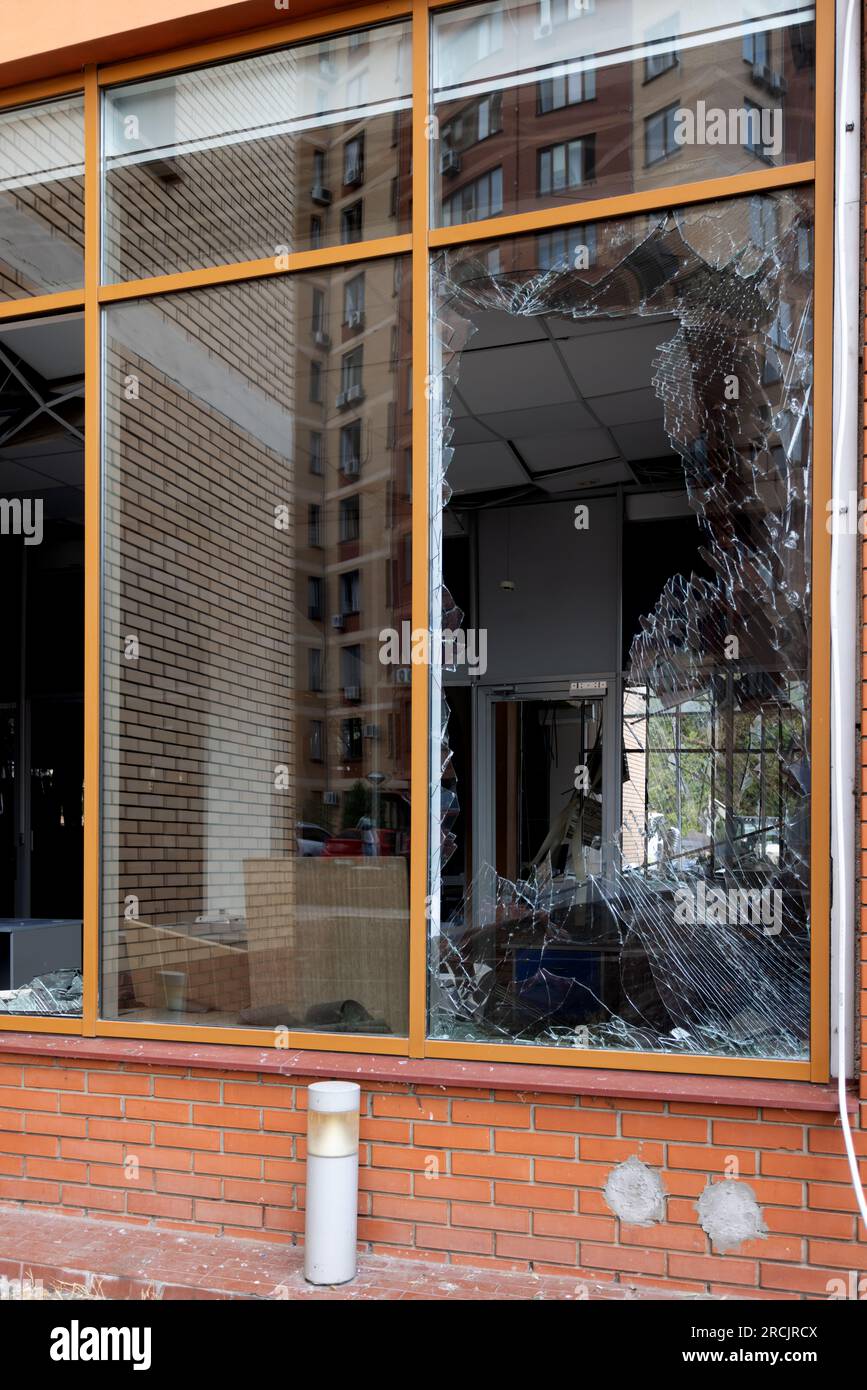 Broken windows of civilian building of bomb explosion. Shards of glass ...