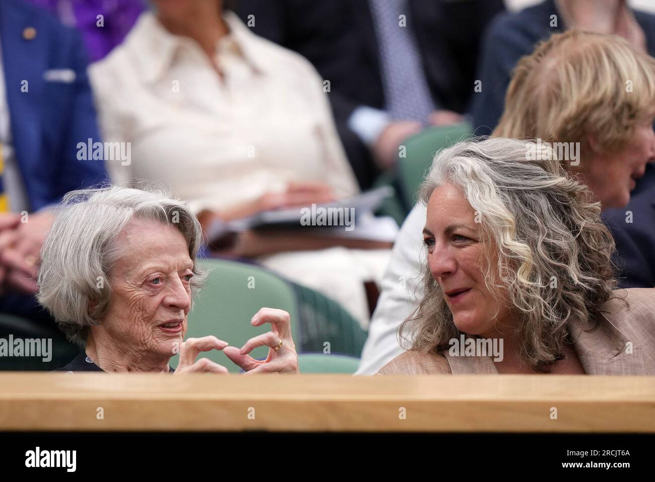 Actress Dame Maggie Smith sits with her daughter-in-law Suki Stephens ...