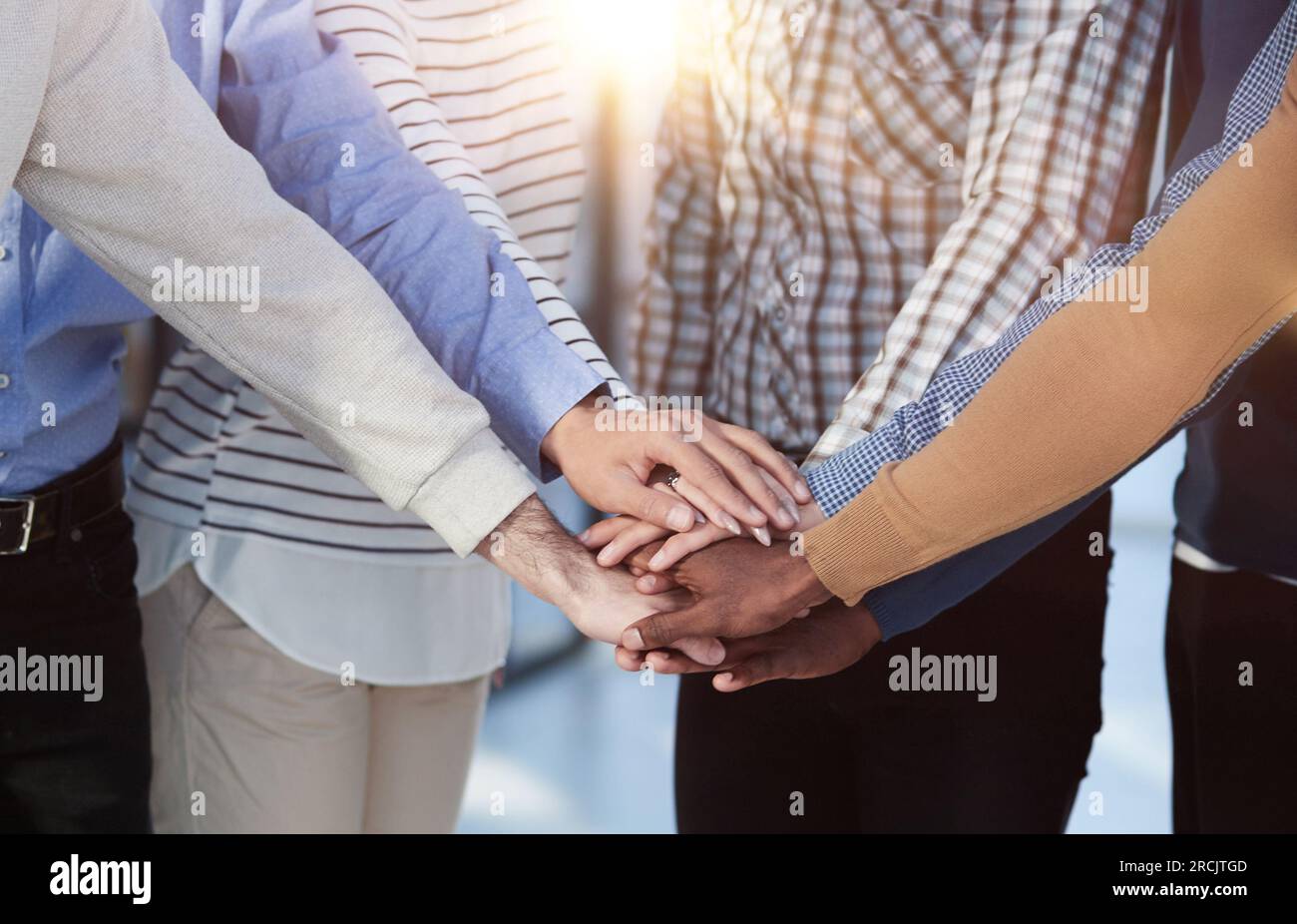 Happy colleagues welcome businessman to their successful team Stock ...