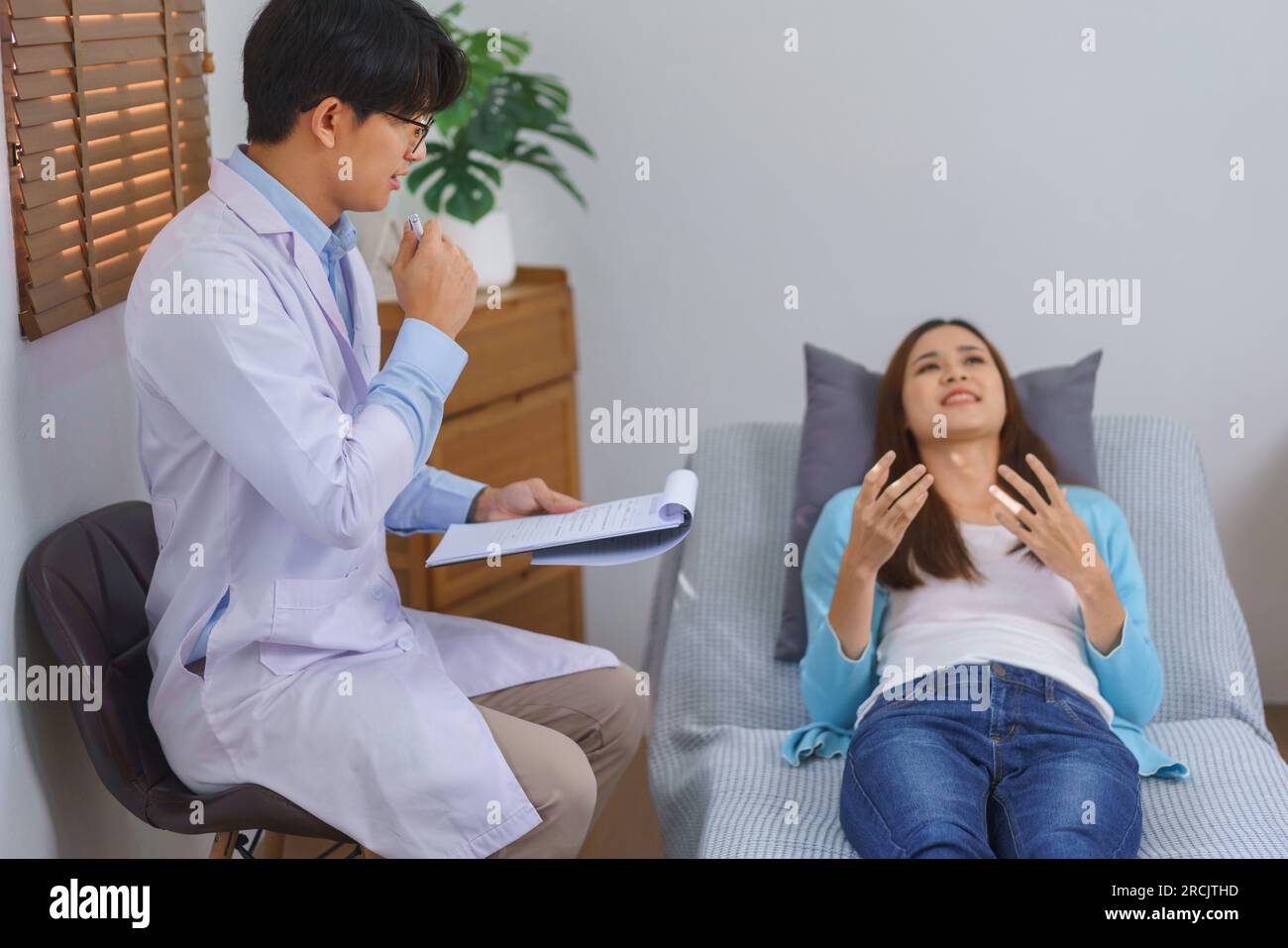 Healthcare concept, Male physiotherapist check injury of female patient ...