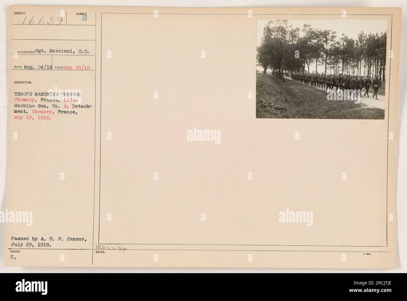 Troops from the 147th Machine Gun detachment are seen marching through ...