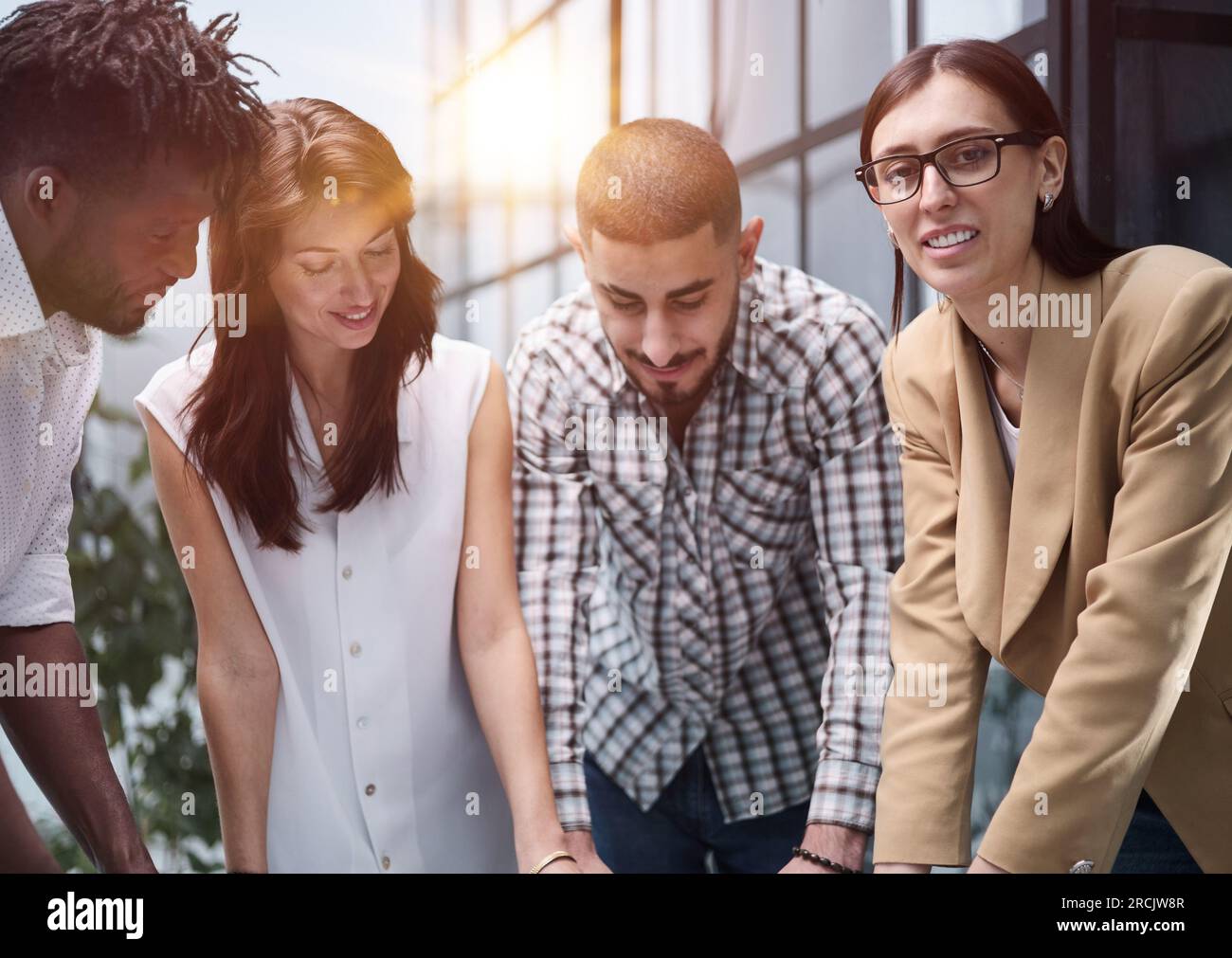 Discussing new project. Group of modern people having a meeting while ...