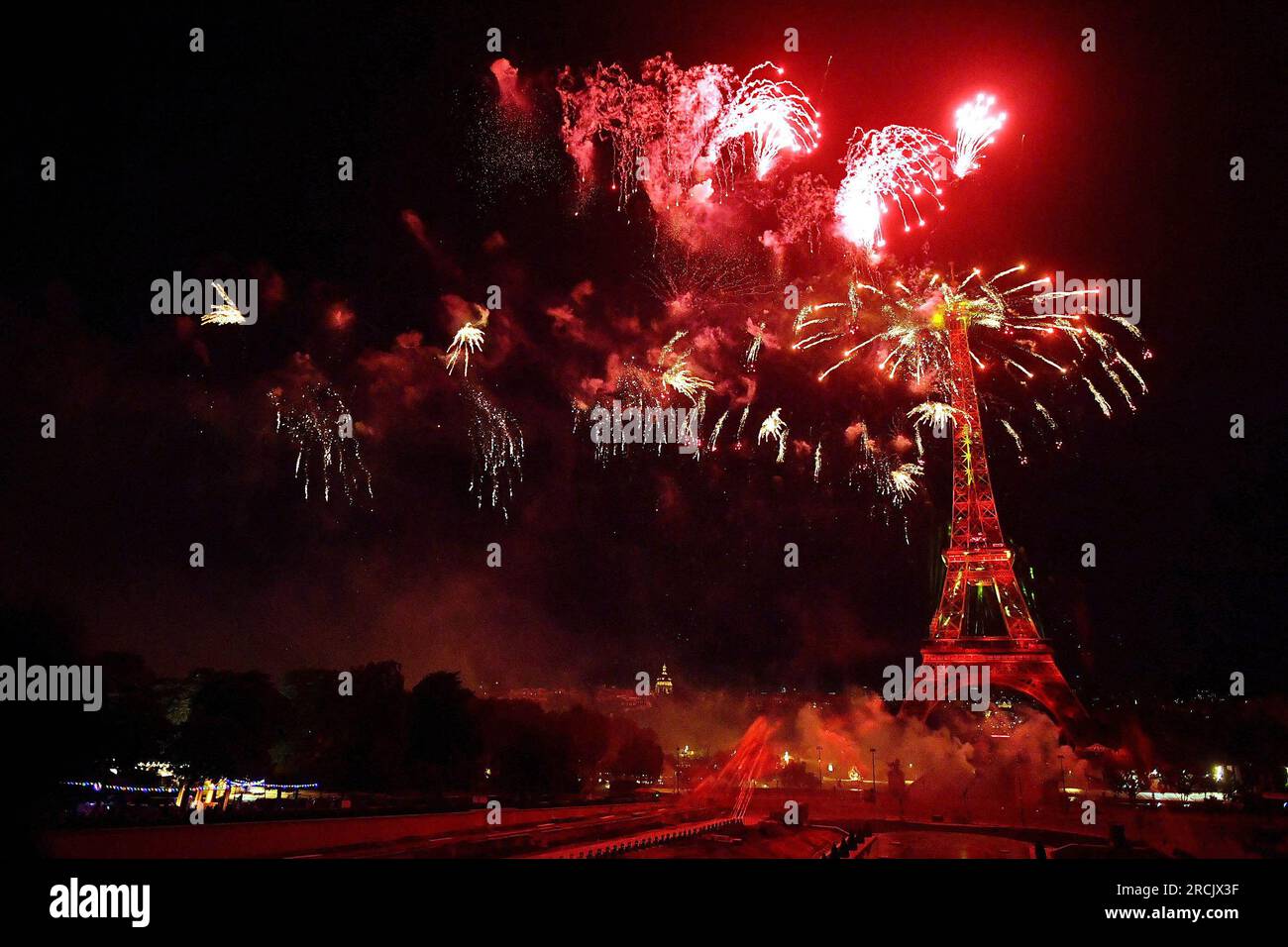 Fireworks light the Eiffel Tower during the Bastille Day celebrations ...