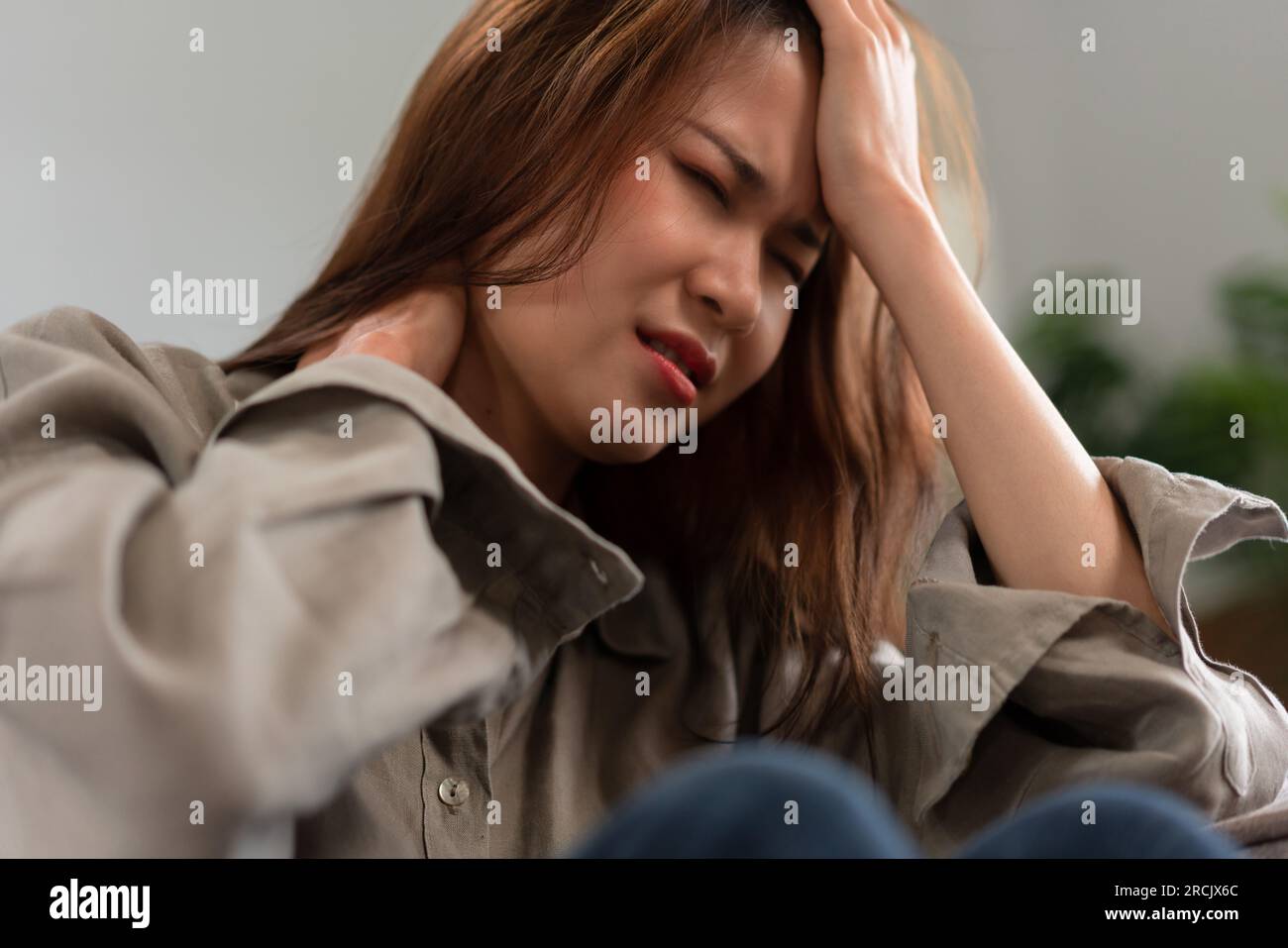 Guitar and singer concept, Young asian woman is feeling headache and ...