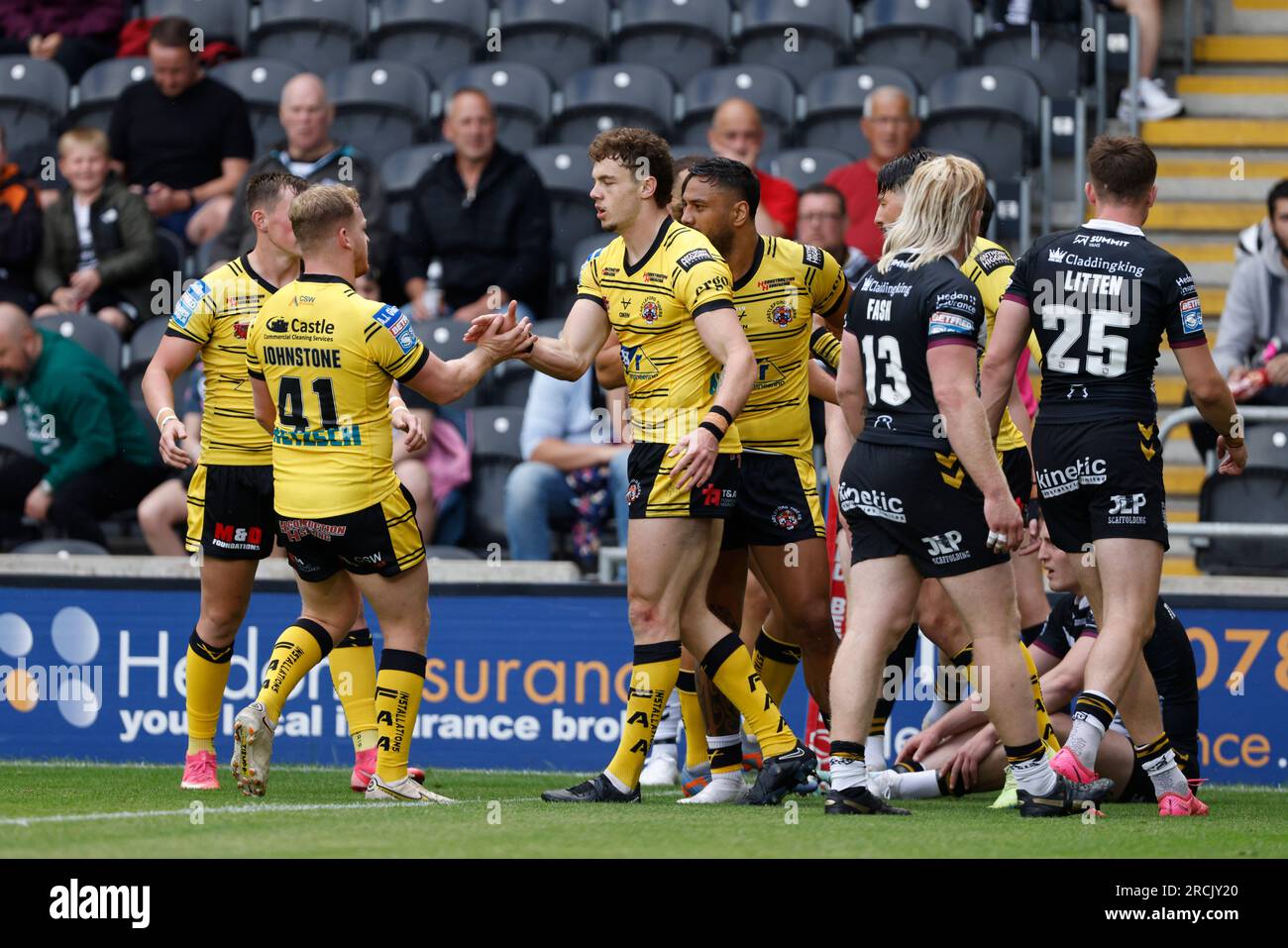Castlefords's Elliot Wallis (centre) celebrates after scoring a try ...