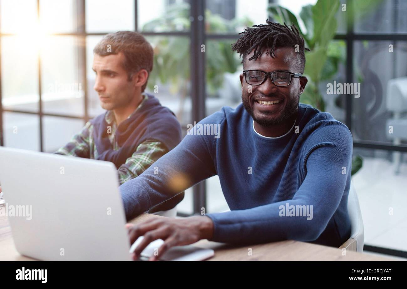 african white colleagues working together use pc corporate apps, mentor ...