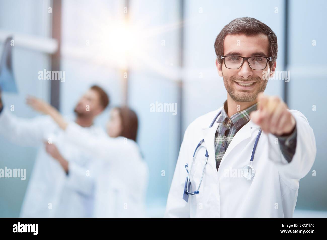 Doctor pointing finger serious expression hi-res stock photography and ...
