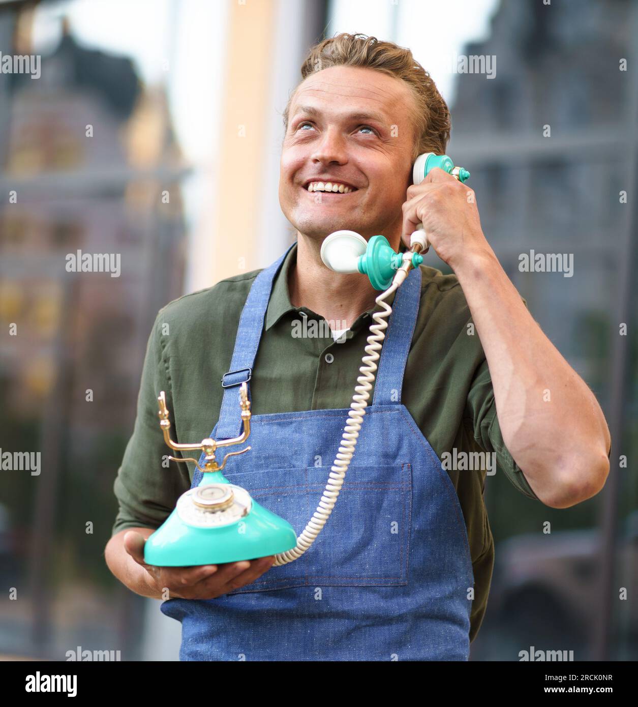 Restaurant service, administrator or waiter receiving client's call on ...