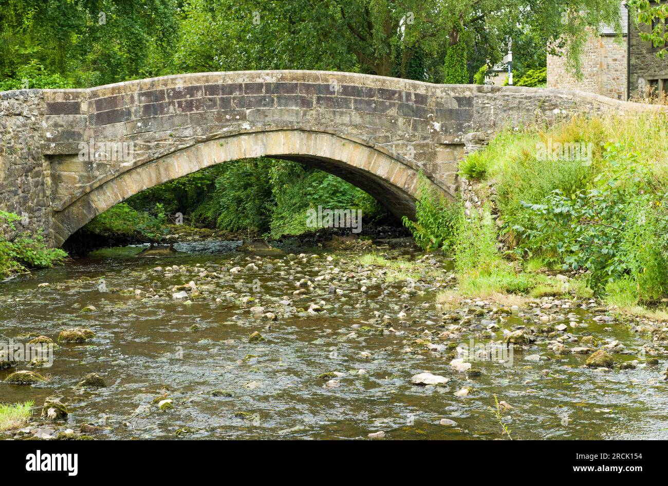 Clapham Village Bridge over the Clapham Beck in Yorkshire Stock Photo ...