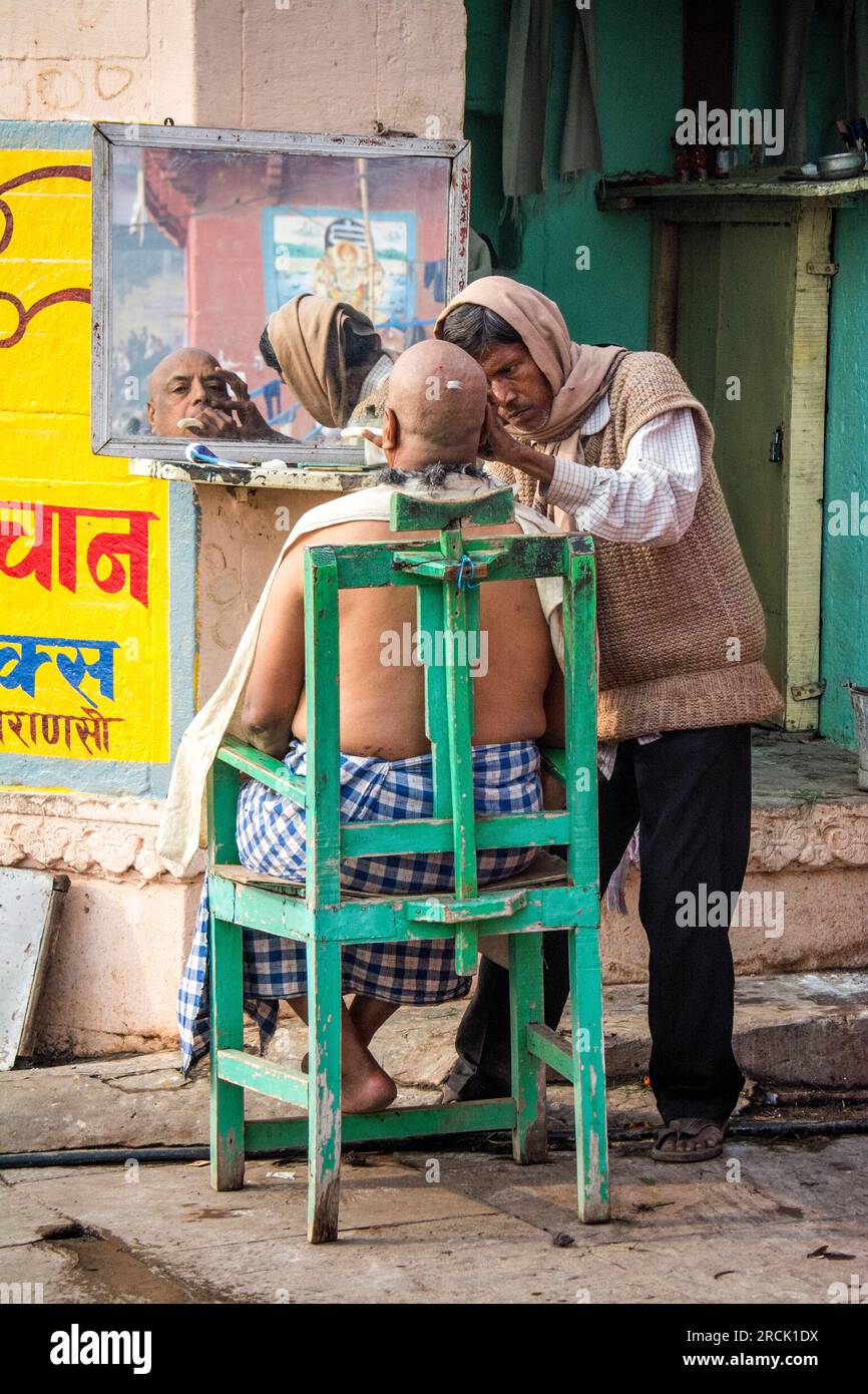 Barber giving a shave on the Ghats of Varanasi, India Stock Photo - Alamy