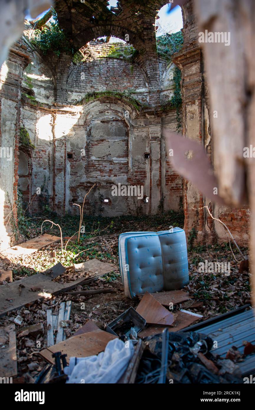 From ruined door inside of abandoned and ruined church with abandoned ...