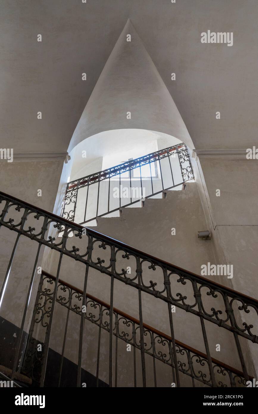 Period staircase shot from below. Perspective of stairway going up or ...